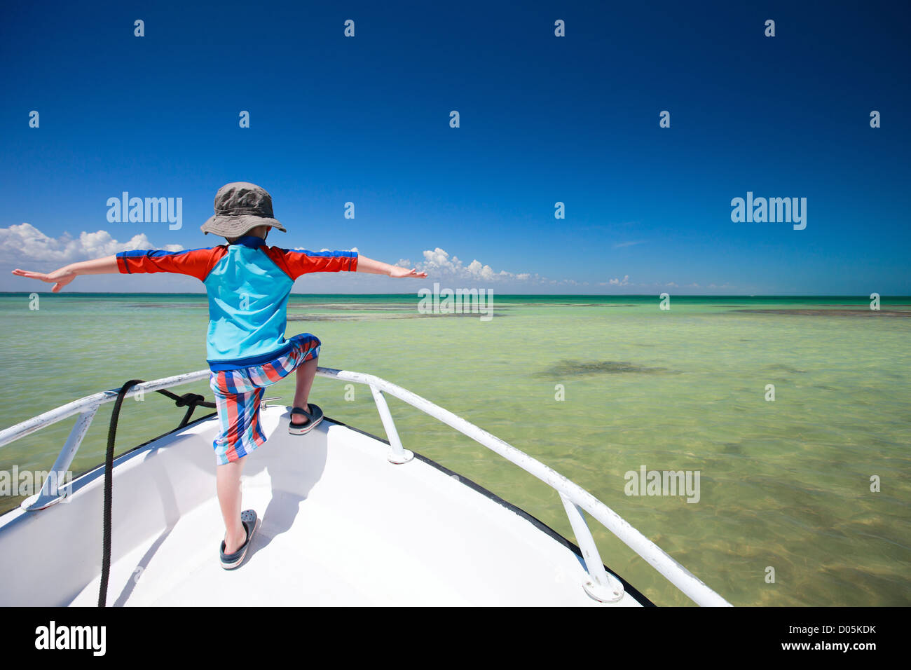 Little boy facing ocean Stock Photo - Alamy