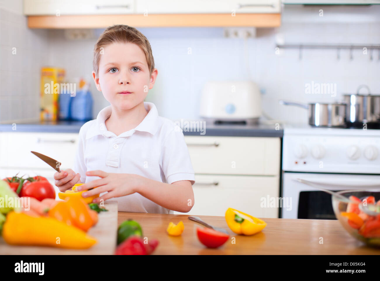 Little boy helping at kitchen Stock Photo - Alamy