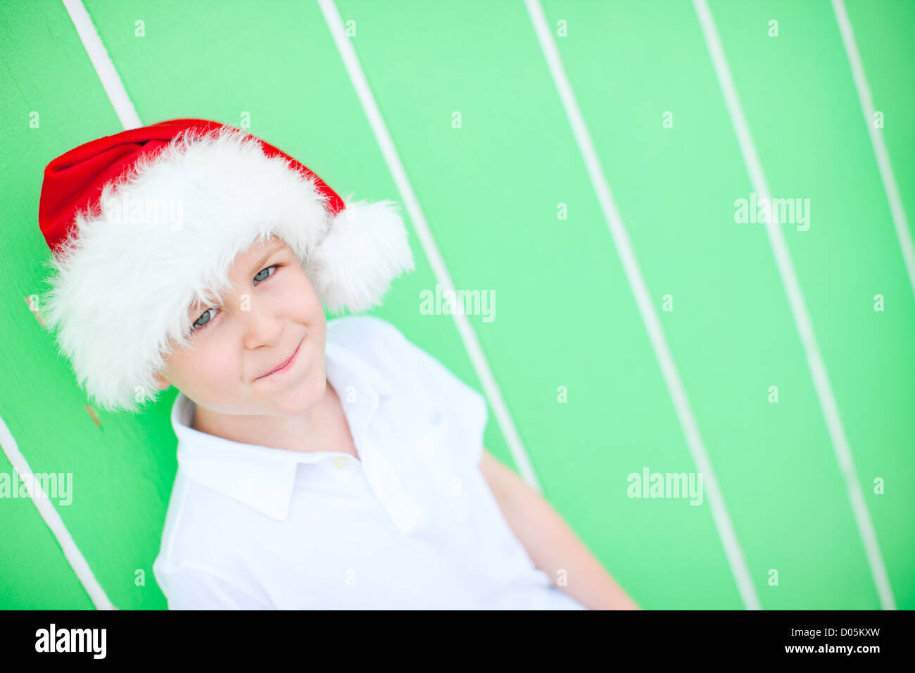 Cute boy in a Santa hat Stock Photo - Alamy