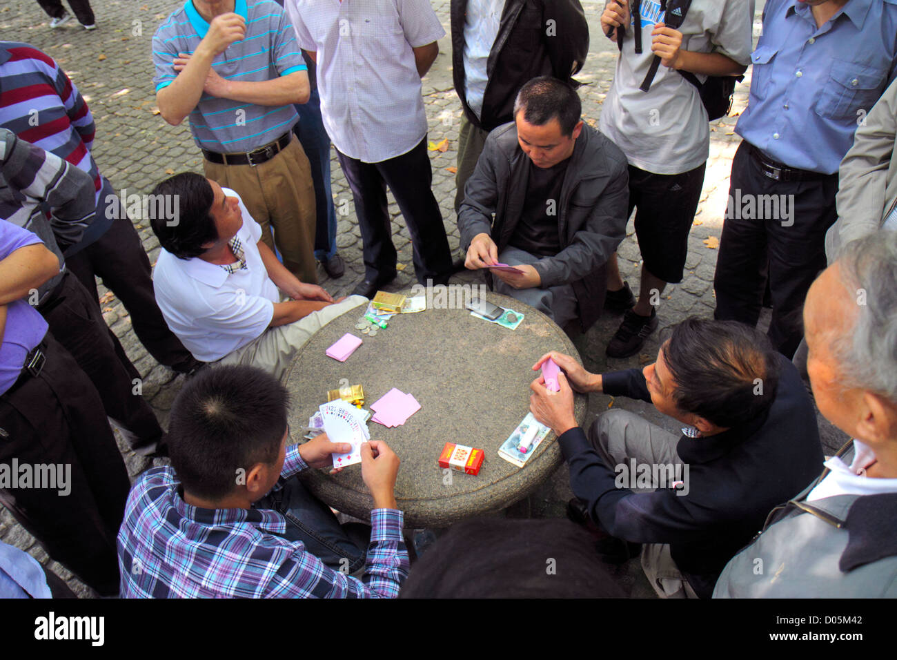 Chinese man playing cards in hi-res stock photography and images - Alamy