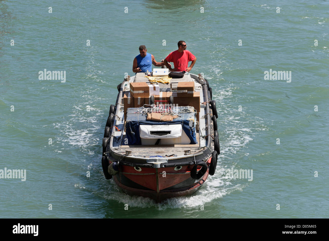 Barge carrying goods, Venice, Italy Stock Photo - Alamy