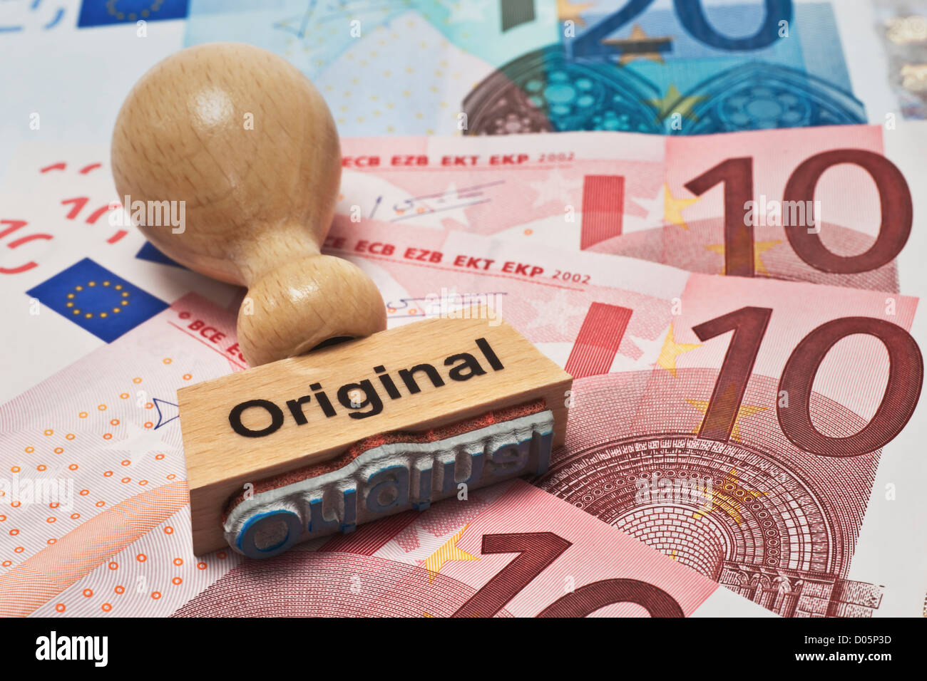 Detail photo of various Euro bills, a stamp with the German inscription ...