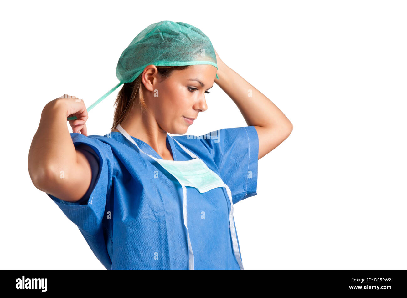 Young female surgeon getting ready for a surgery, isolated in a white ...