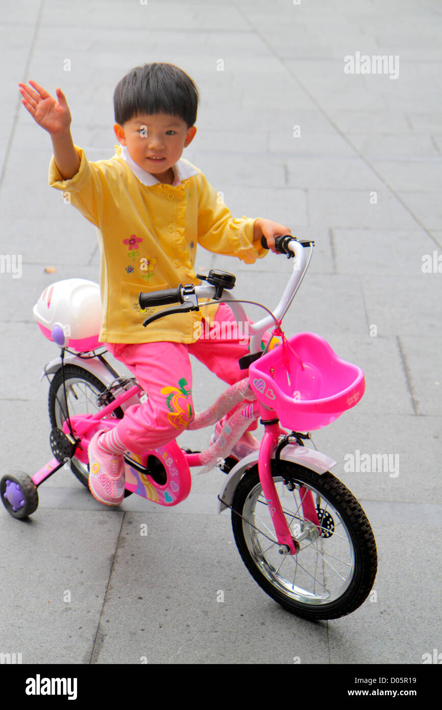 Asian girls riding bicycle hi-res stock photography and images - Alamy
