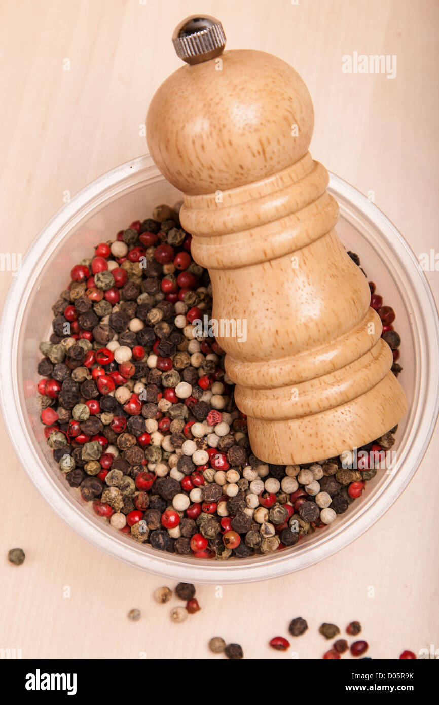 different pepper corn in bowl with pepper mill Stock Photo - Alamy