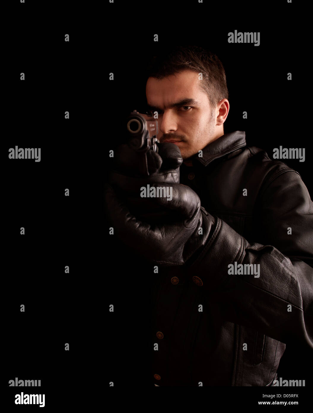 Man with gun leather jacket hi-res stock photography and images - Alamy