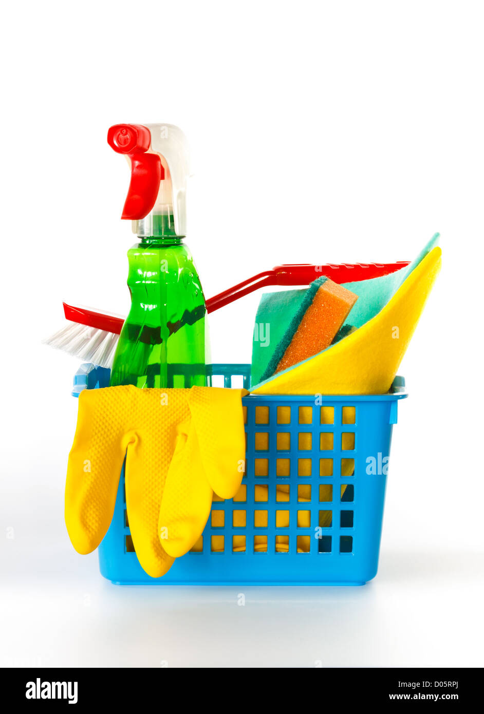 Several kitchen cleaning products in a basket on a white background ...