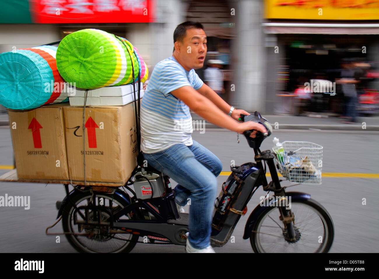 Chinese man riding scooter in High Resolution Stock Photography and ...