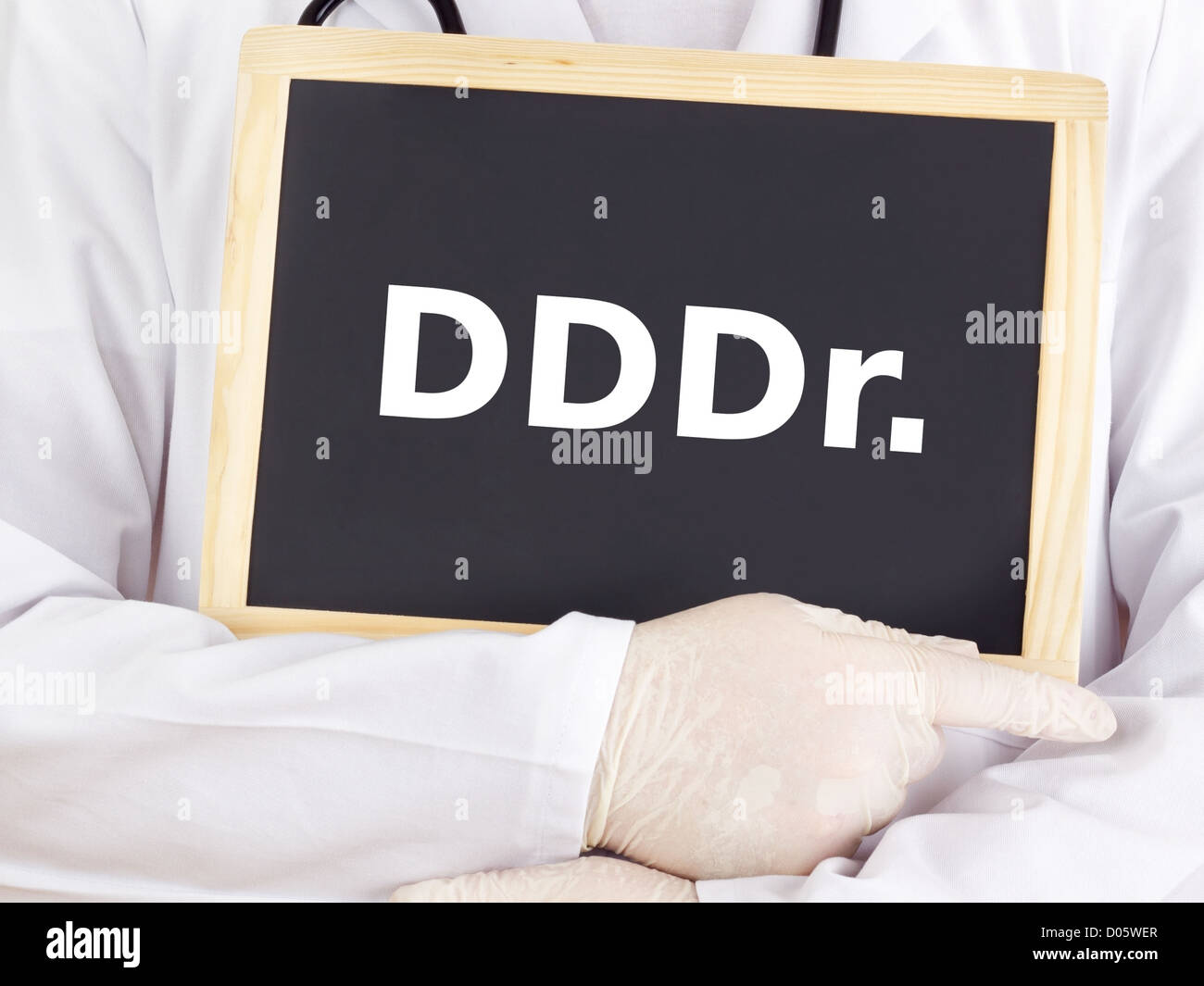 Doctor shows information on blackboard: dddr Stock Photo - Alamy