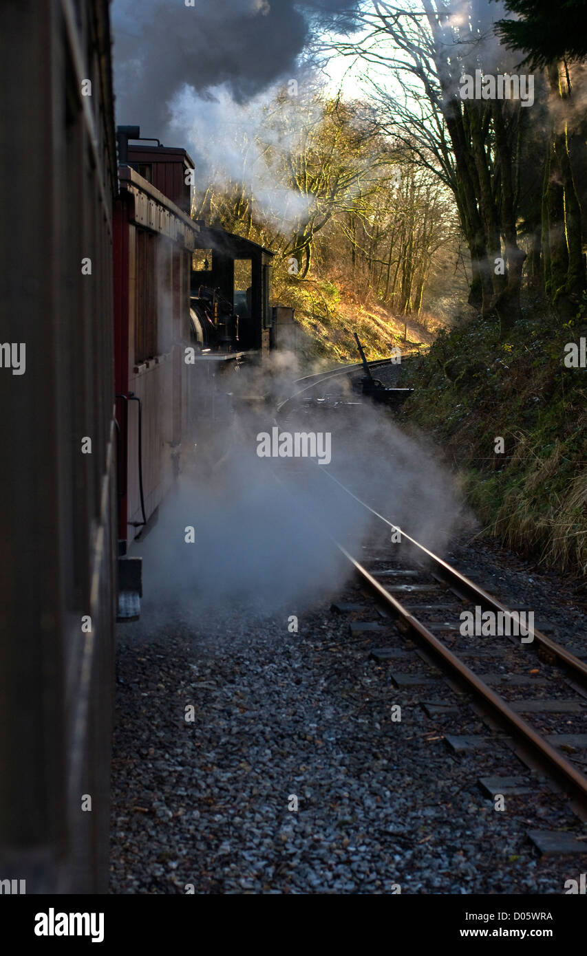 Steam train on track Stock Photo - Alamy