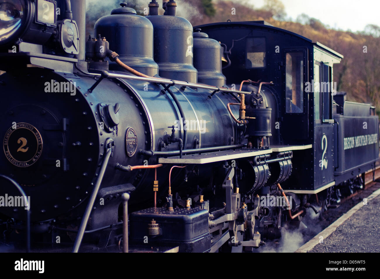 Steam train on track Stock Photo - Alamy