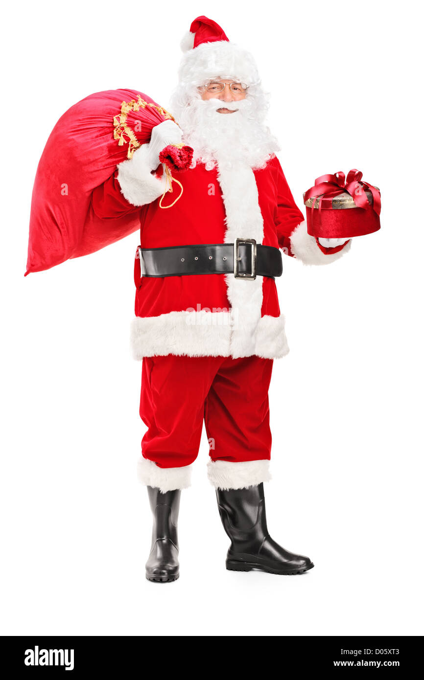 Full length portrait of a Santa Claus holding a bag full of presents ...