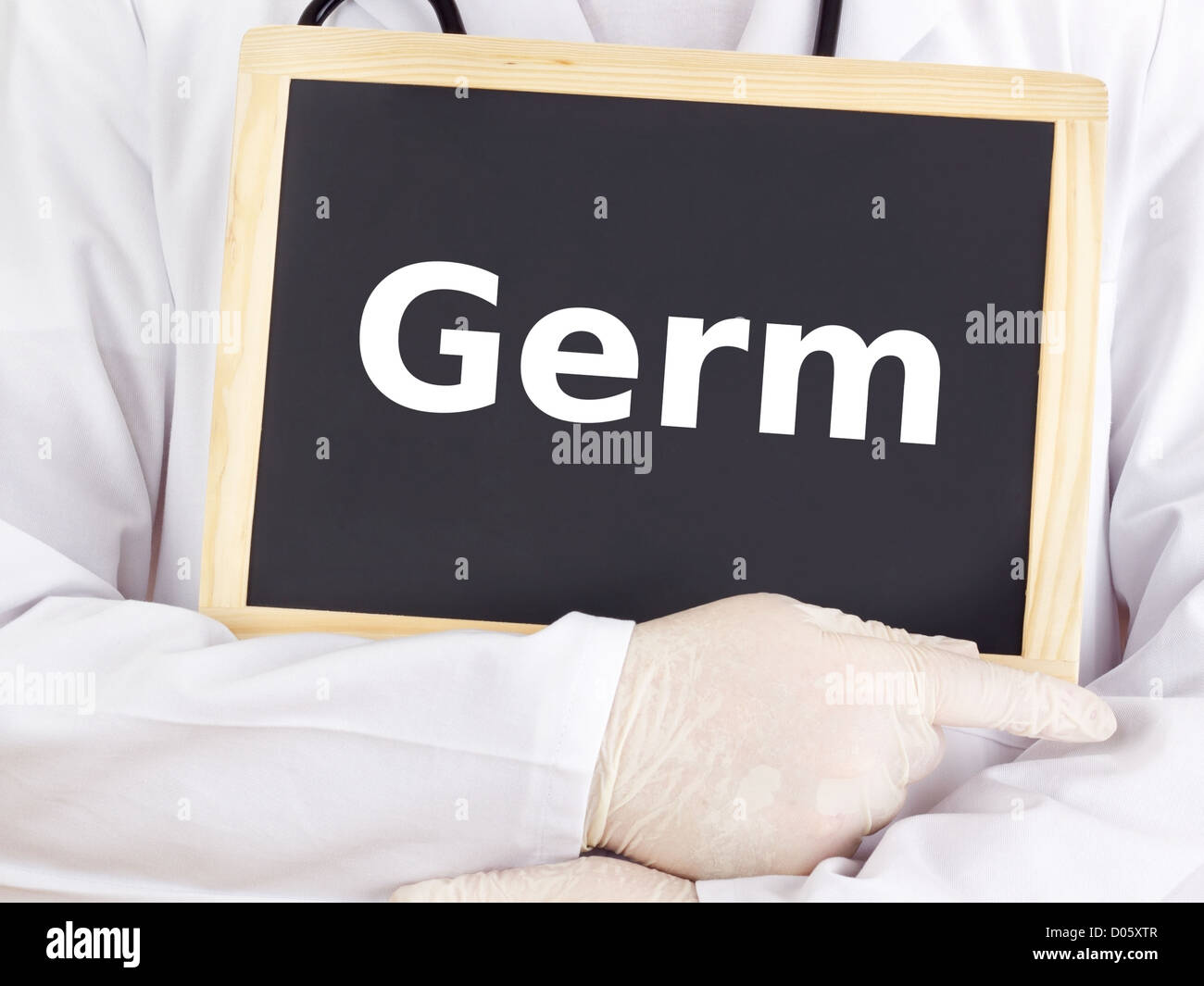 Doctor shows information on blackboard: germ Stock Photo - Alamy
