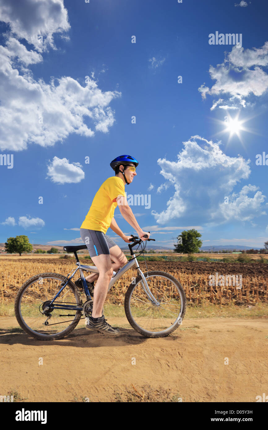 Male bicyclist riding a bike outdoors Stock Photo - Alamy