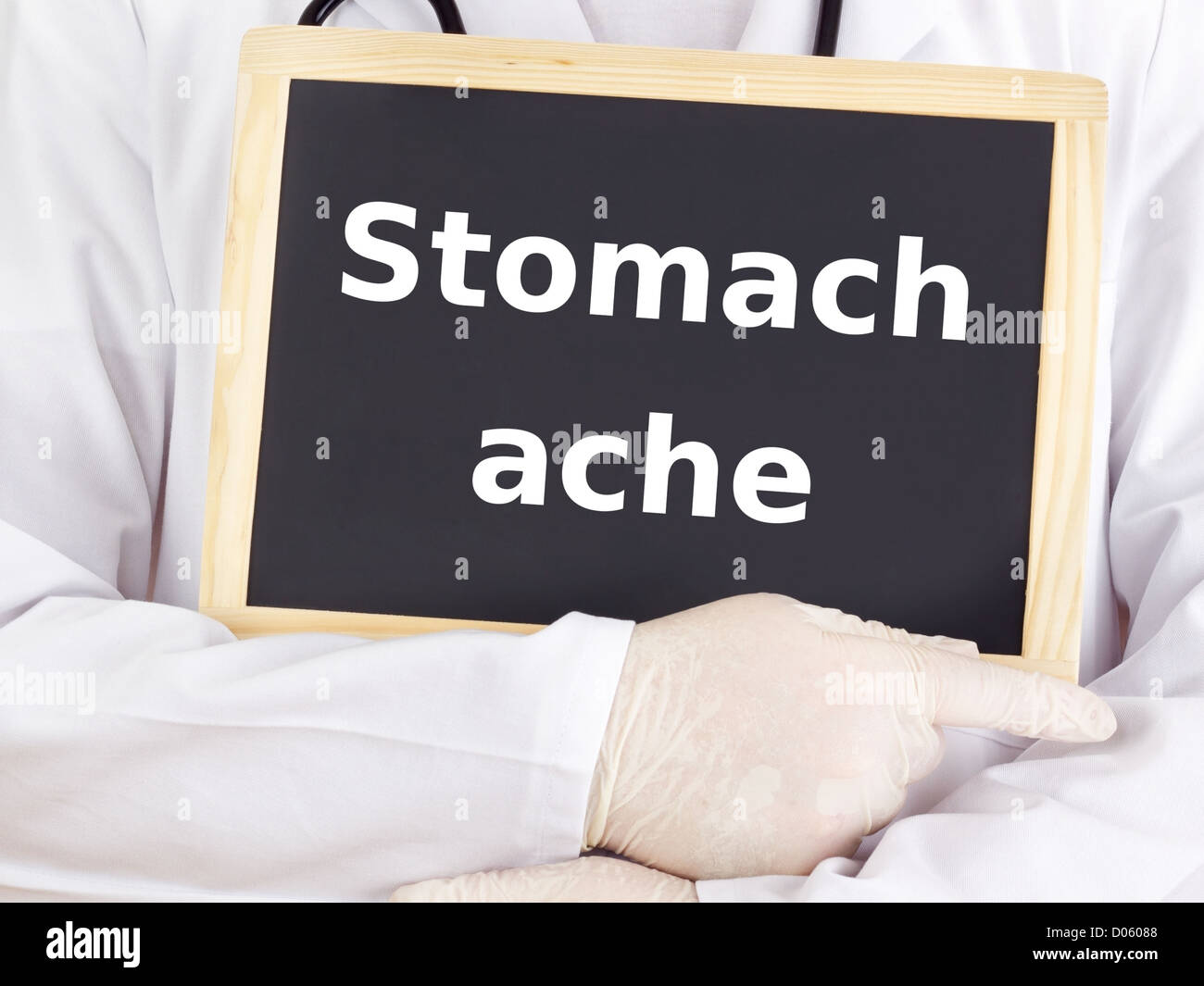 Doctor shows information: stomach ache Stock Photo - Alamy
