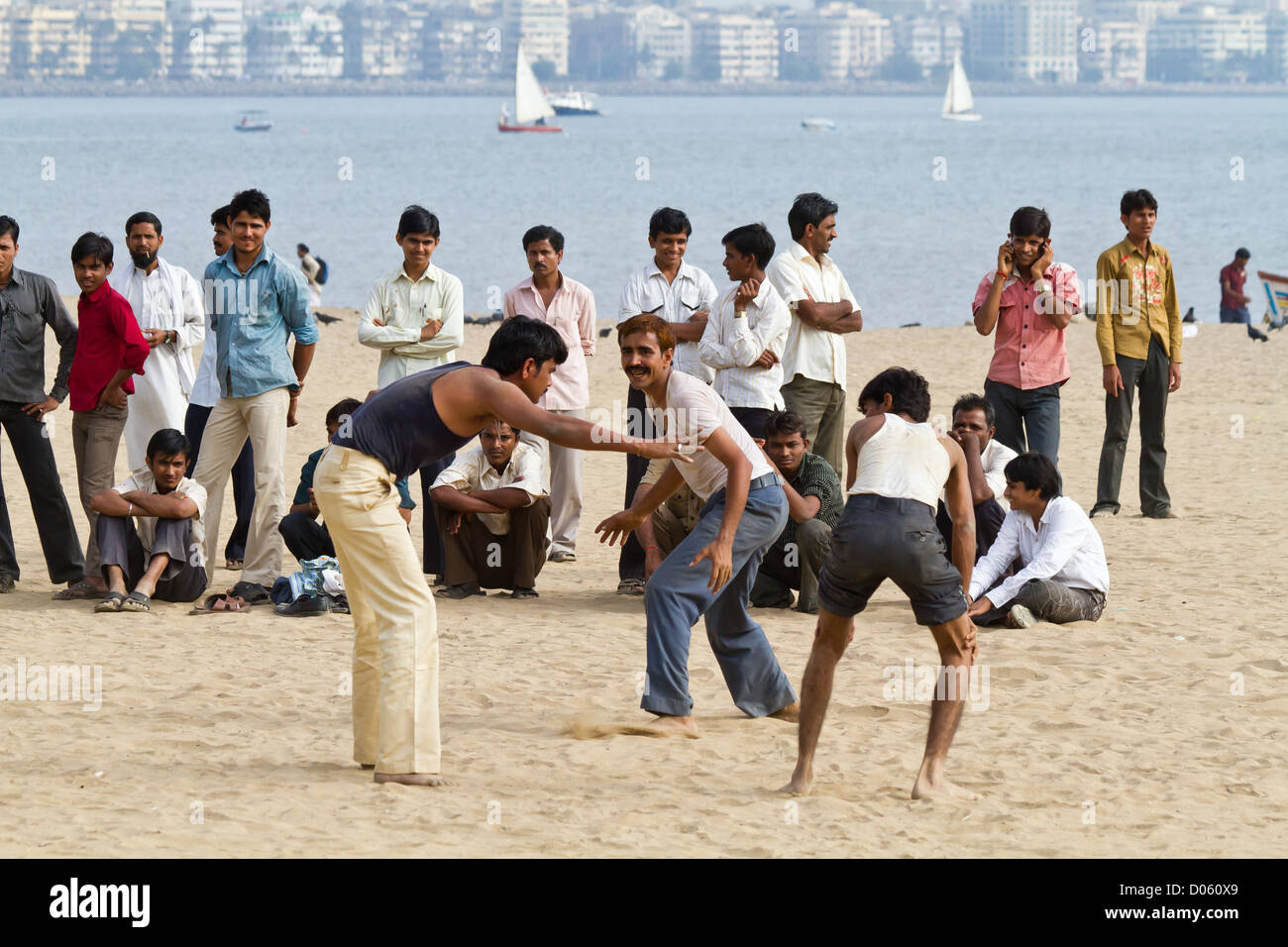 People fighting on the beach hi-res stock photography and images - Alamy