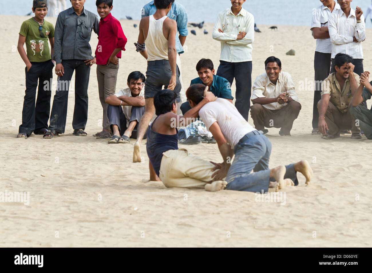 Young Men fighting on the Chowpatty Beach in Mumbai, India Stock Photo ...