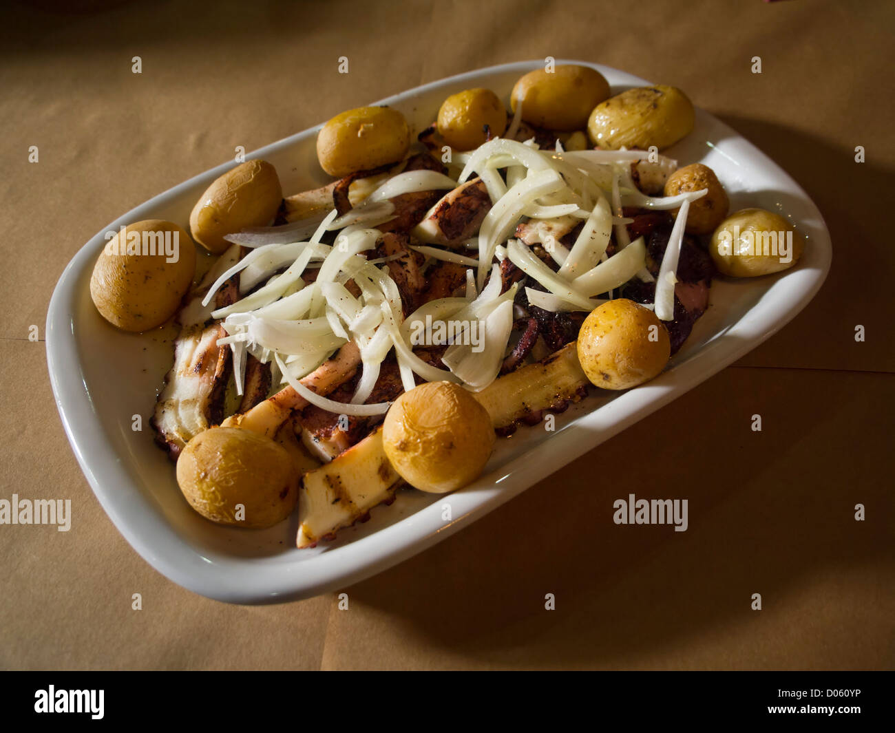 Typical portuguese dish Polvo à Lagareiro - octopus cooked with ...