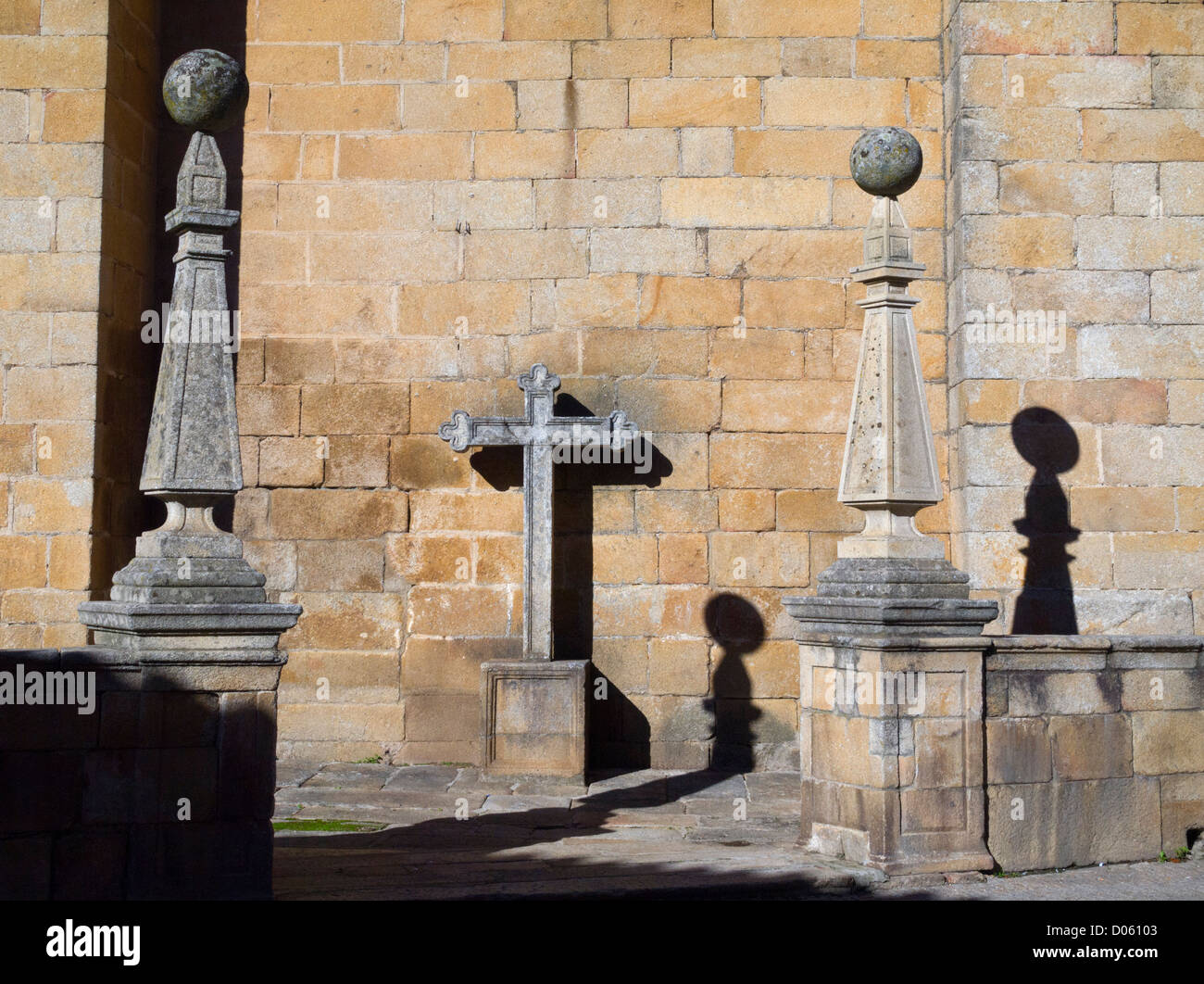 Stone cross against the wall of a church Stock Photo - Alamy