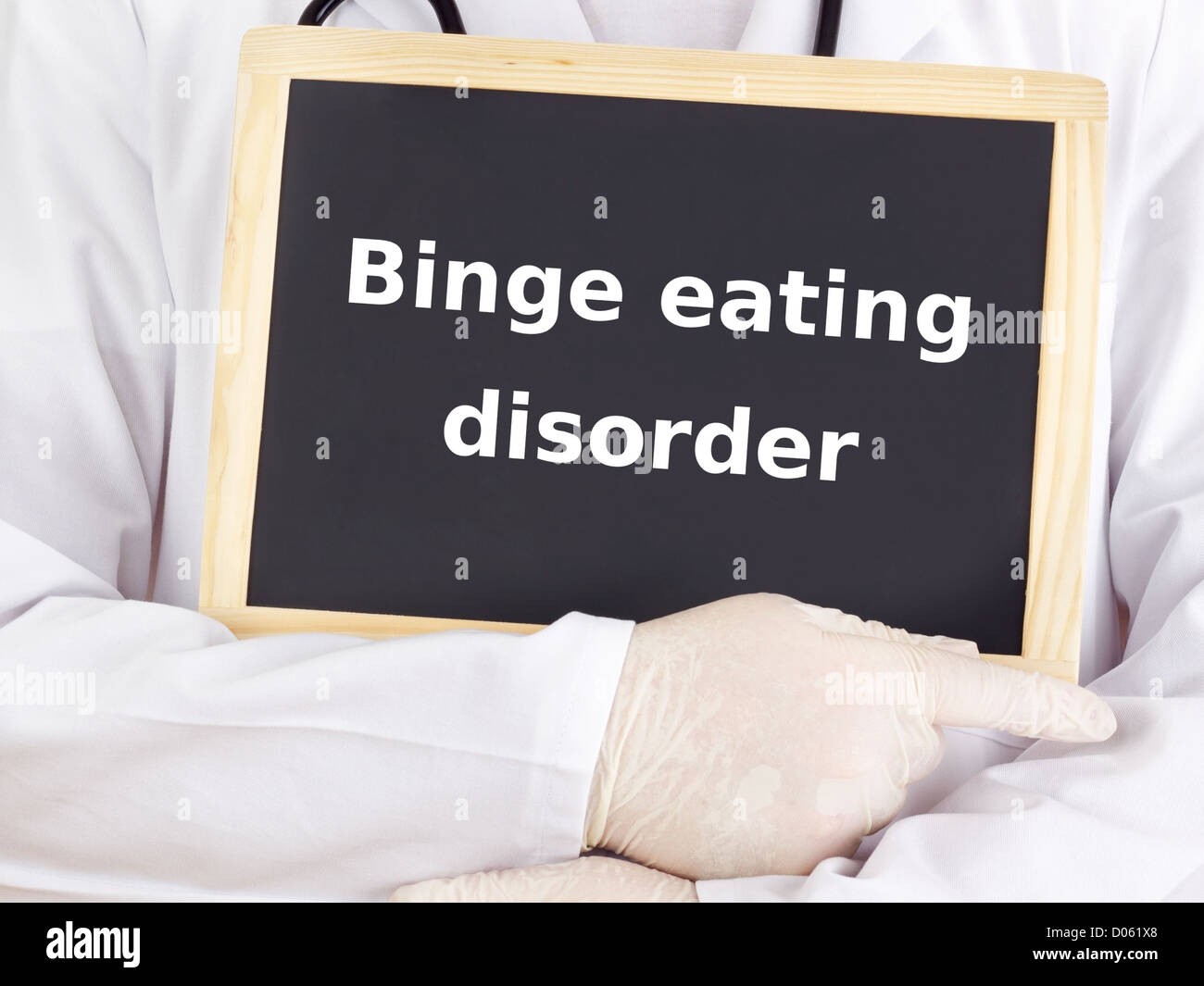 Doctor shows information: binge eating disorder Stock Photo - Alamy