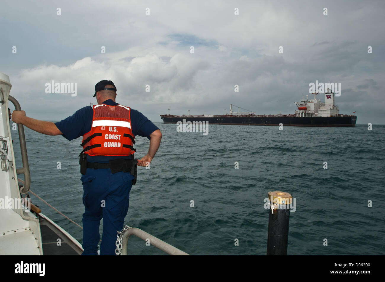 US Coast Guard boat approaches tanker ship for boarding, Port Aransas ...