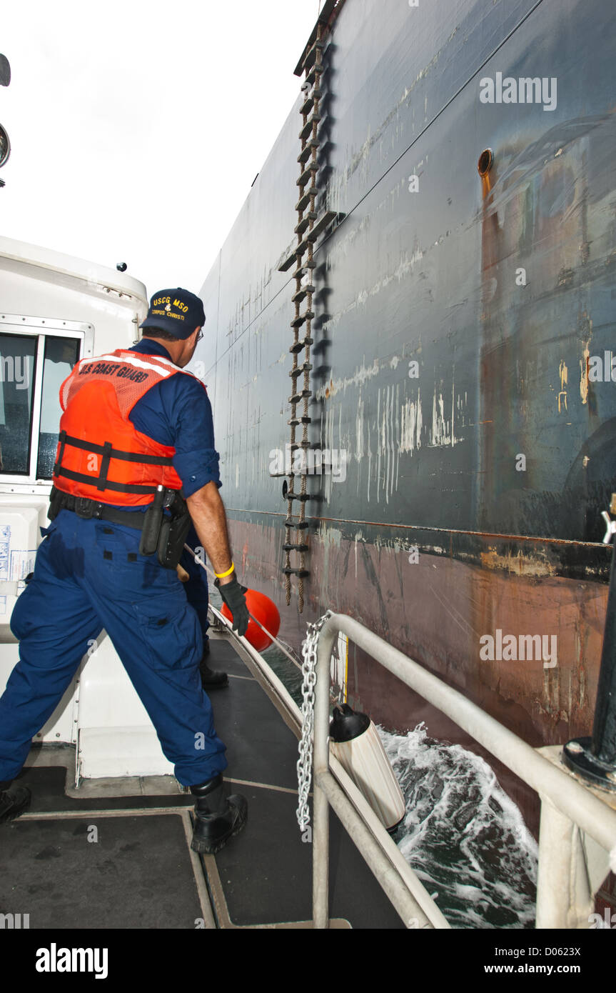 US Coast Guard boat approaches tanker ship for boarding, Port Aransas ...