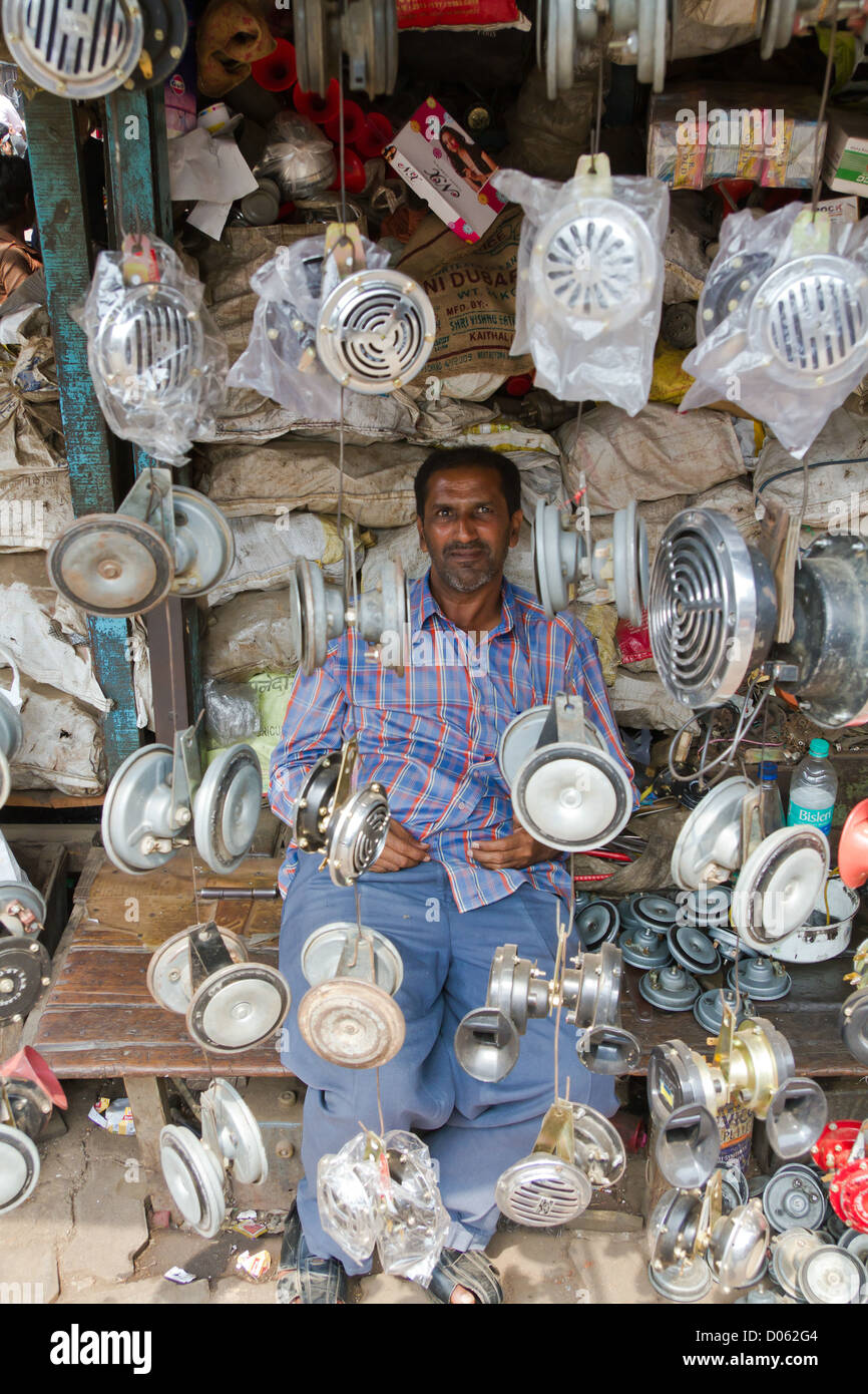 Man sitting behind Metal Pots in Chor Bazáar in Mumbai, India Stock ...