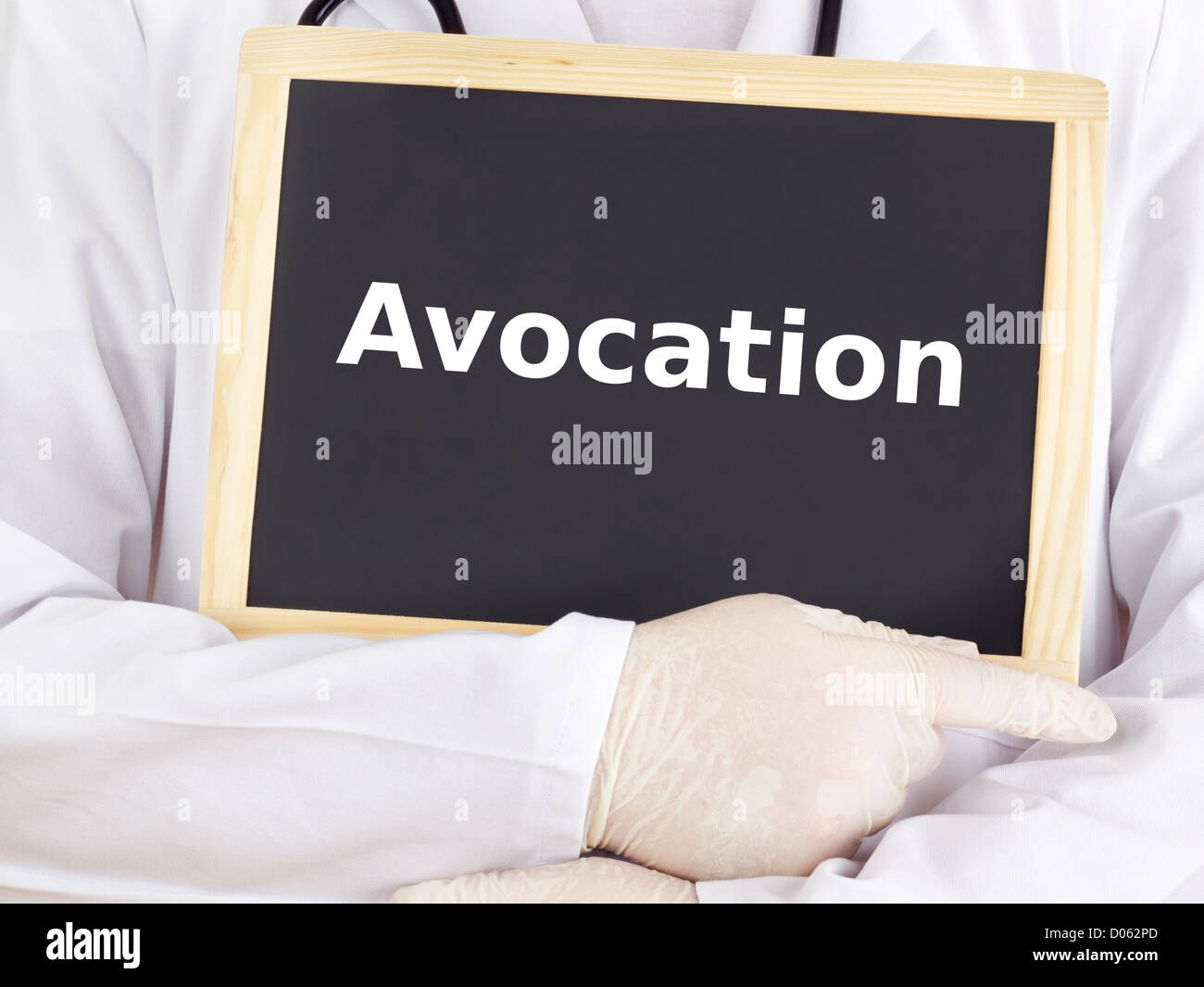 Doctor shows information on blackboard: avocation Stock Photo - Alamy