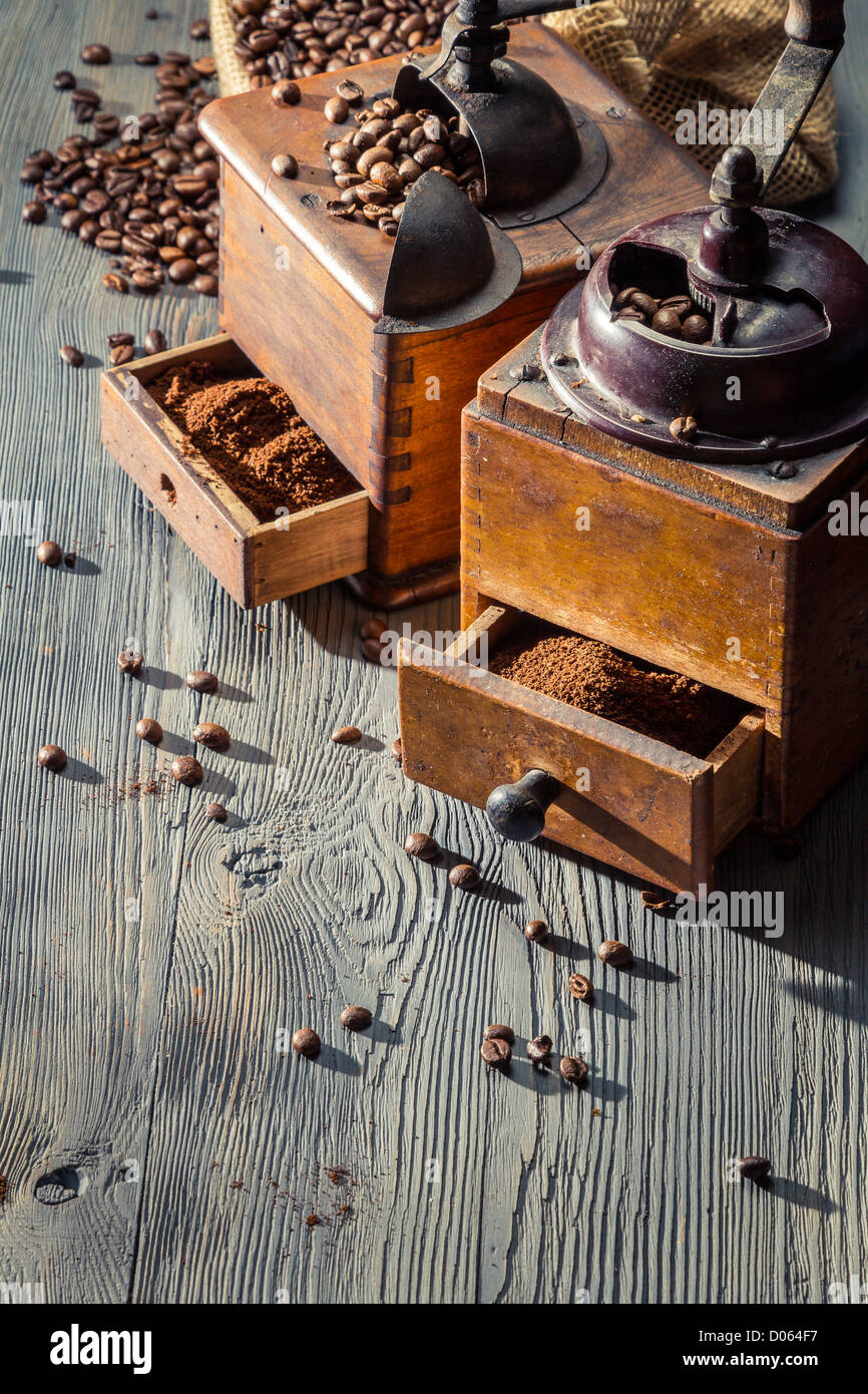 Making coffee by vintage grinders Stock Photo - Alamy