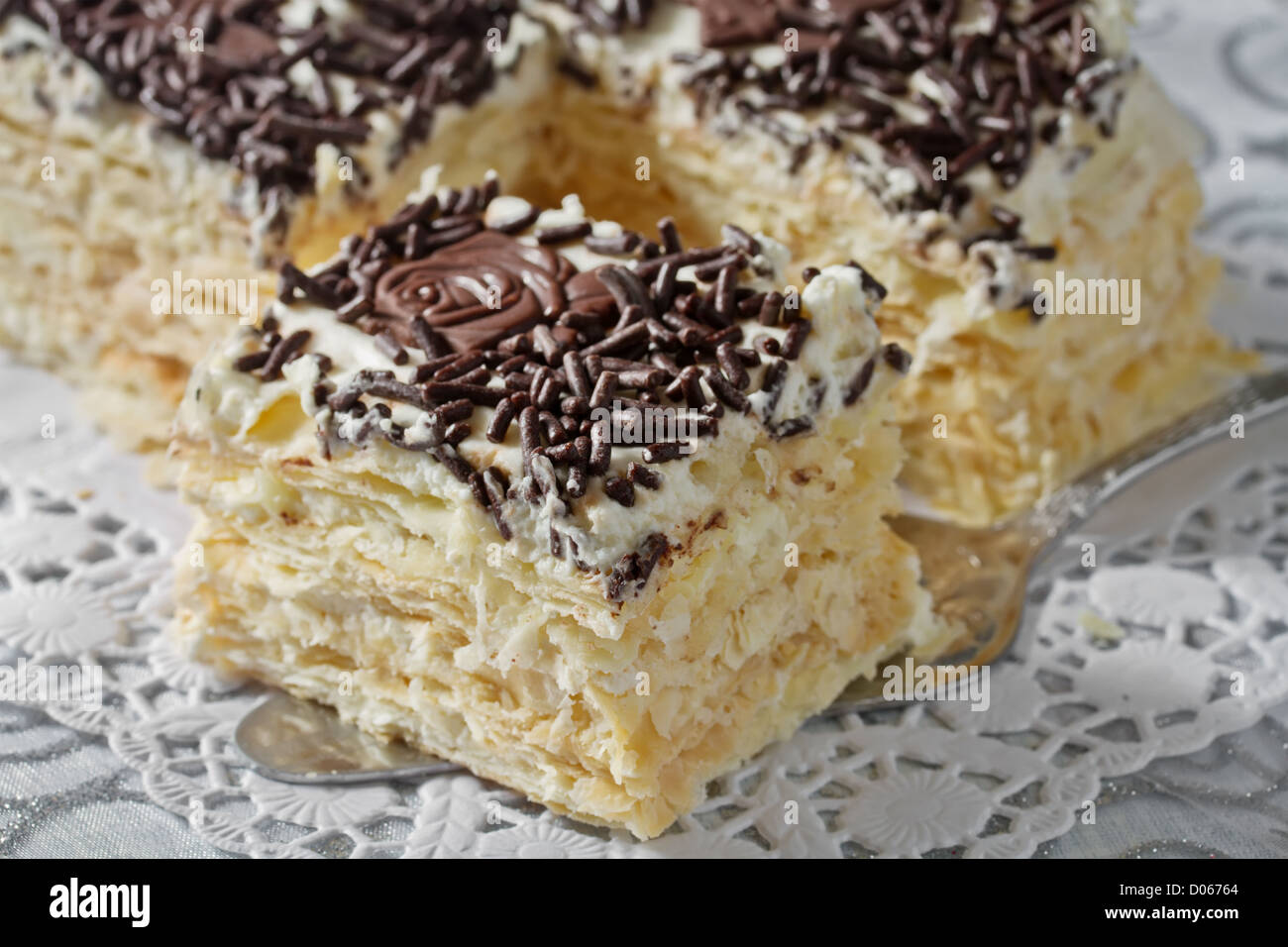 Cake from flaky pastry with whipped cream Stock Photo - Alamy