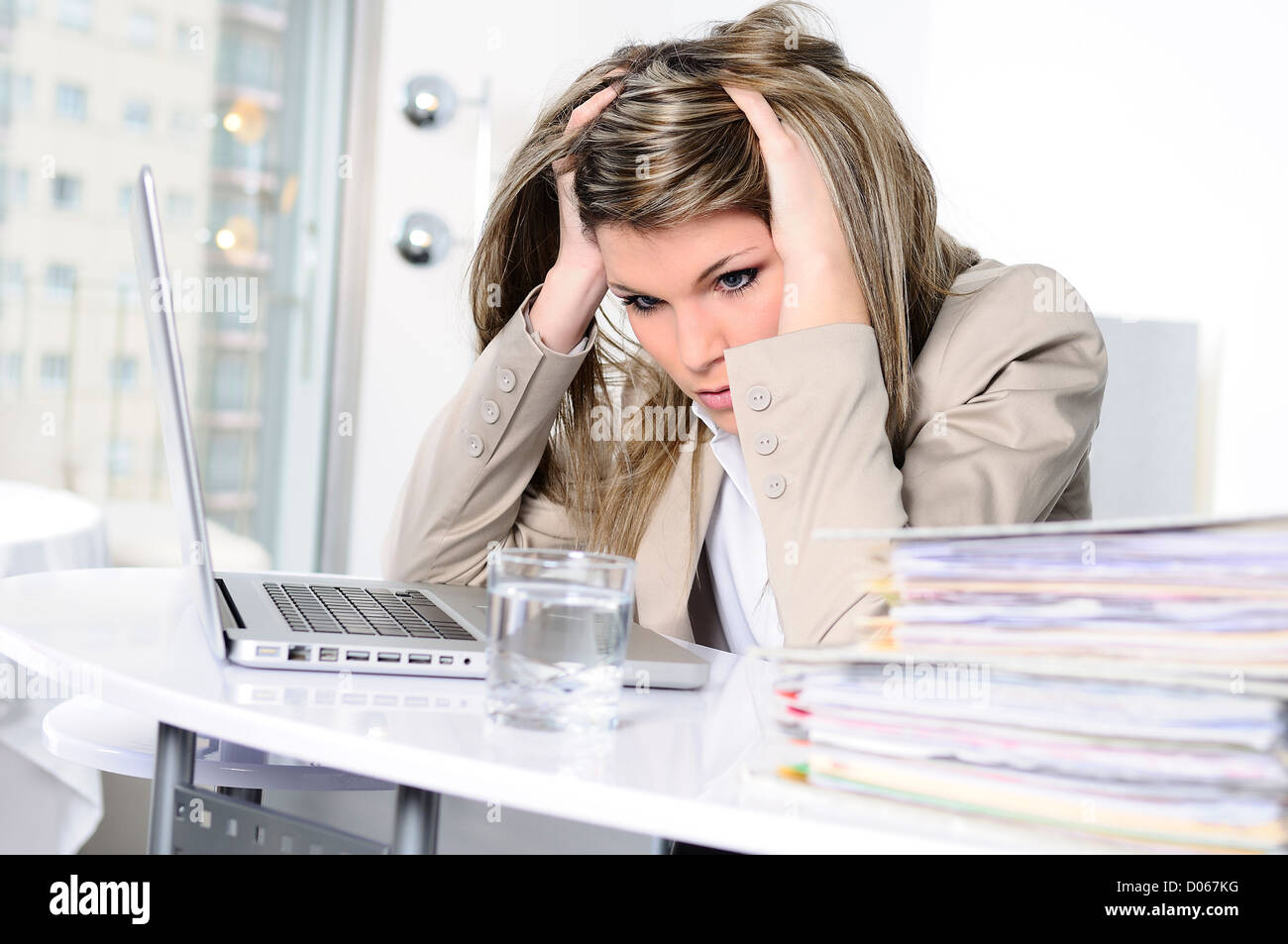stressed woman working on computer Stock Photo - Alamy