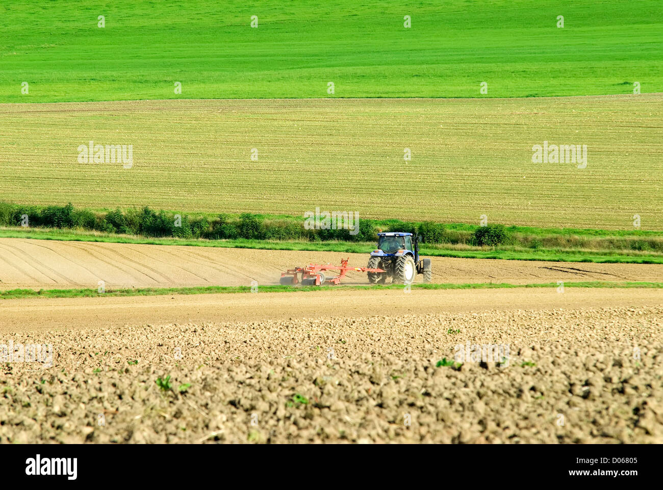 a tractor at work in the field Stock Photo - Alamy
