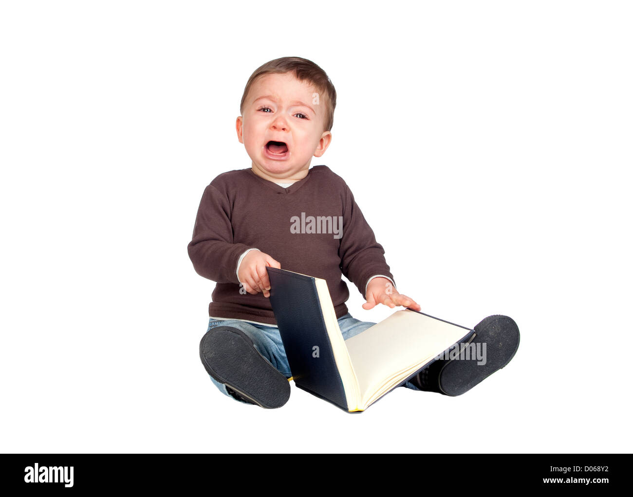 Beautiful baby with a book crying isolated on white background Stock ...