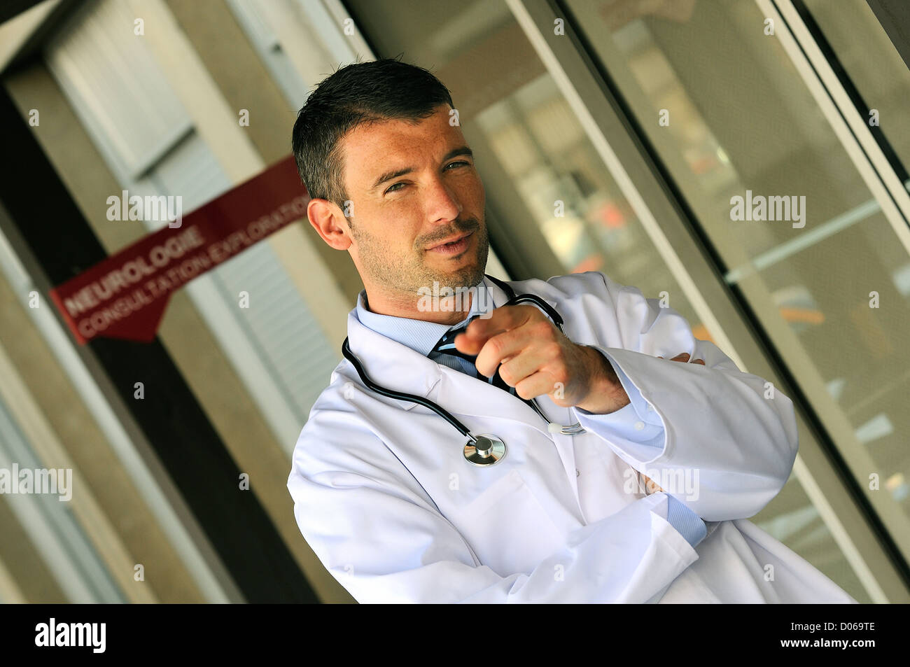 portrait of doctor in front an entrance of the hospital Stock Photo - Alamy