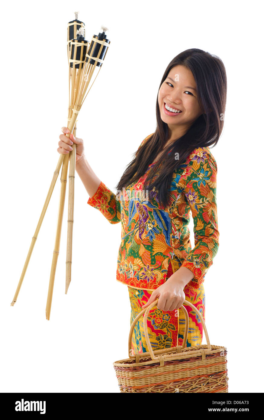 Happy young Malay woman ready to celebrate Hari Raya Aidilfitri / Eid ...