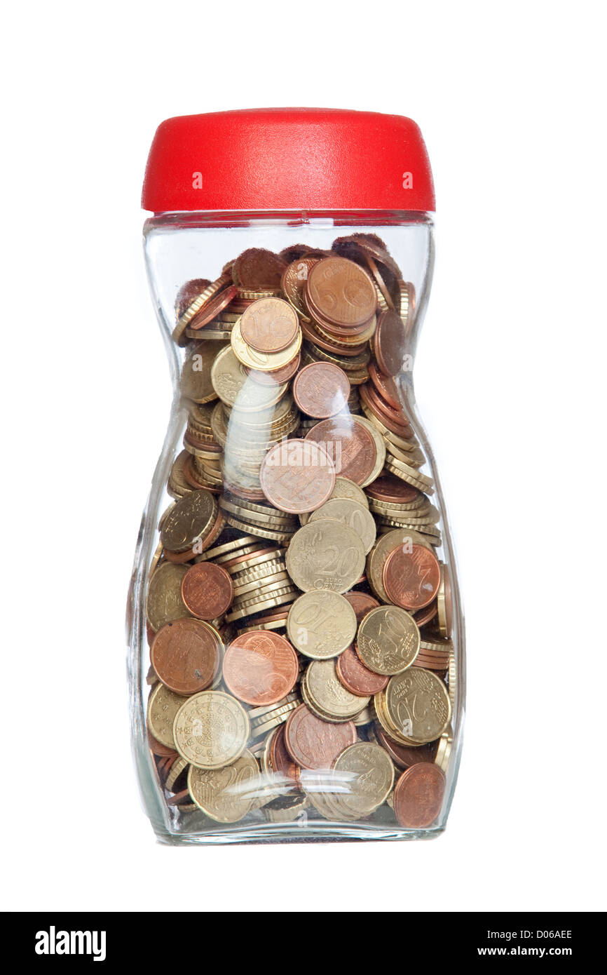Glass bottle full of coins isolated on white background Stock Photo - Alamy