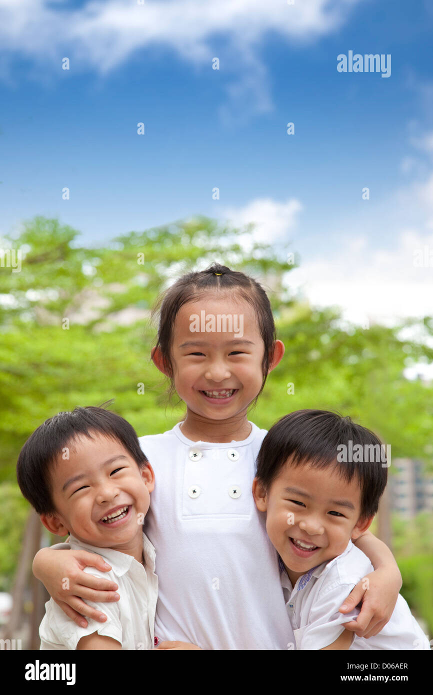three happy asian kids Stock Photo - Alamy