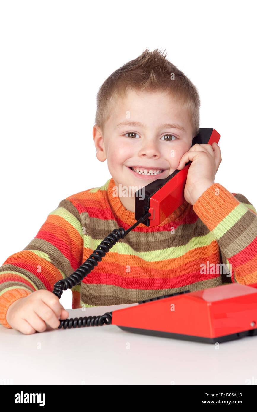 Adorable child with a tradicional telephone isolated over white Stock ...