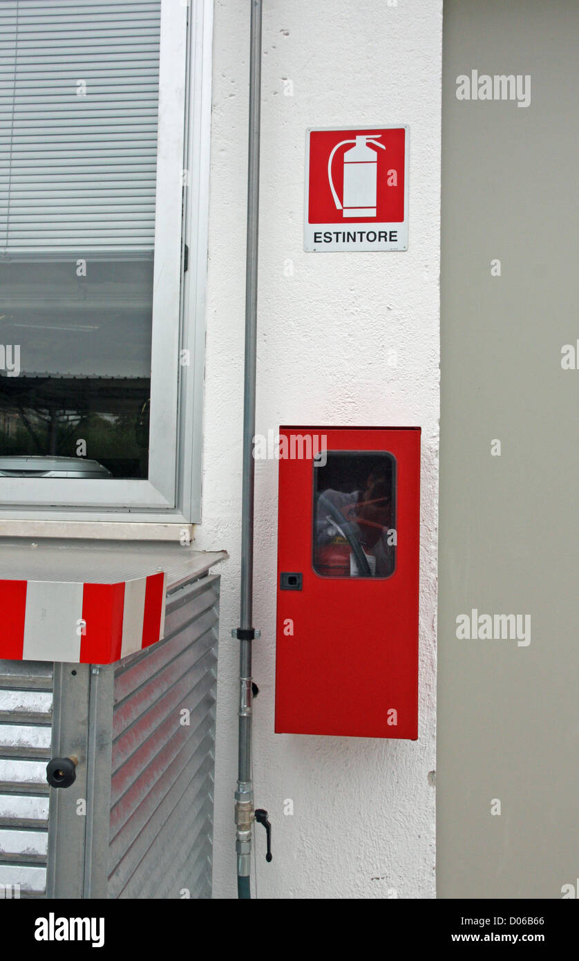 red warning sign of presence in a factory fire extinguisher Stock Photo ...