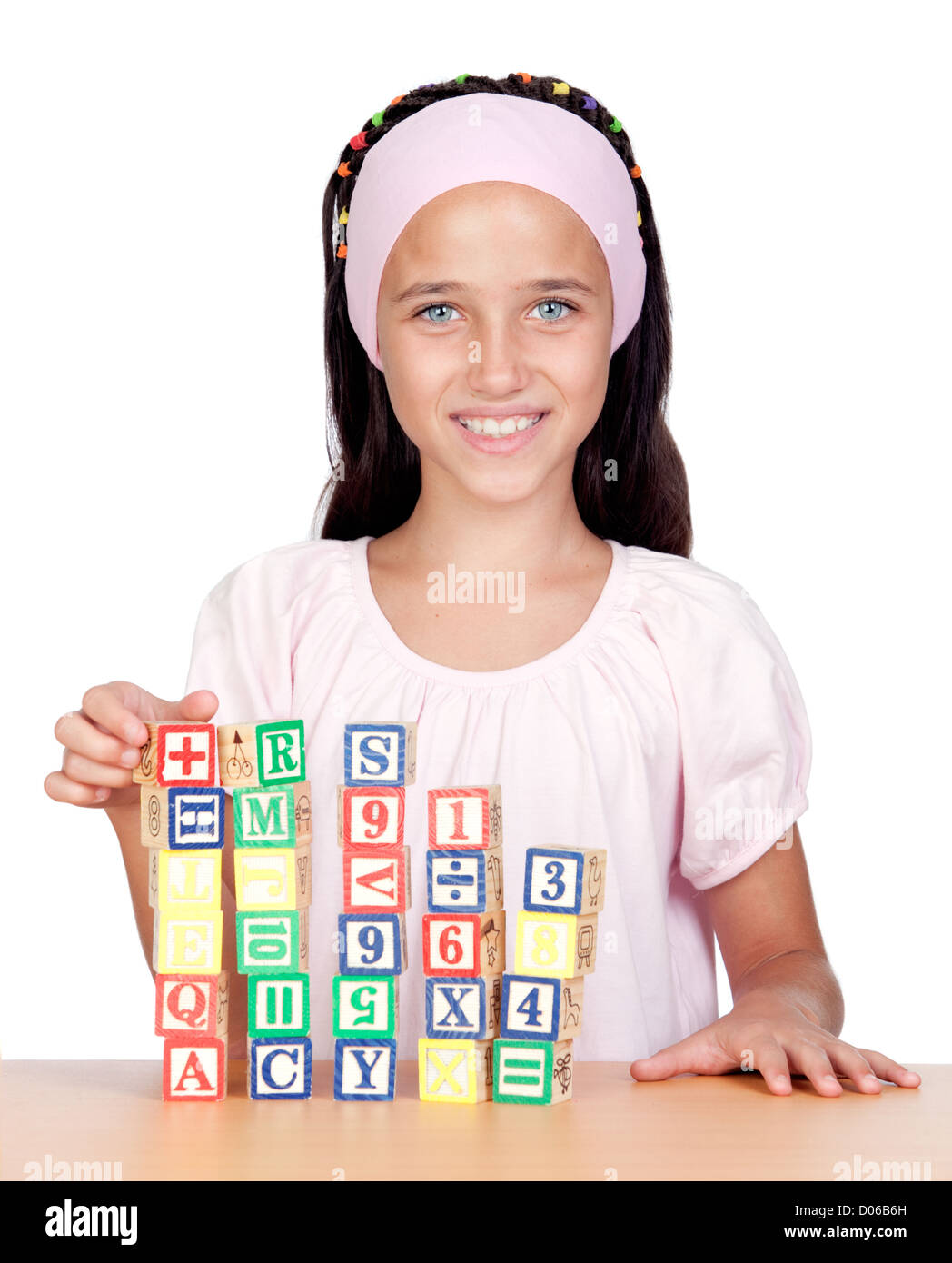 Little girl with with wooden blocks stacked isolated on white ...