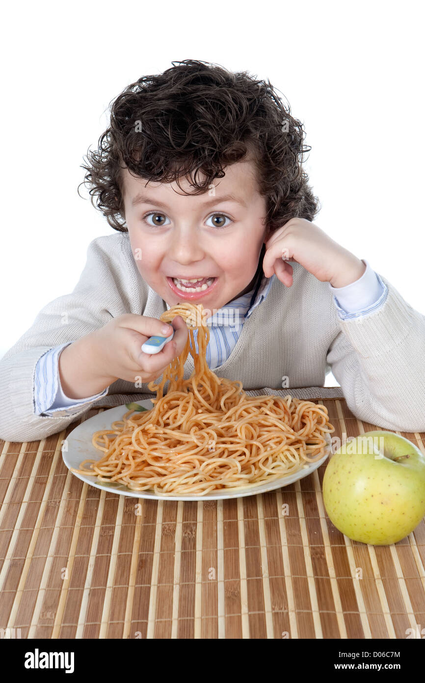 Adorable child hungry at the time of eating a over white background ...
