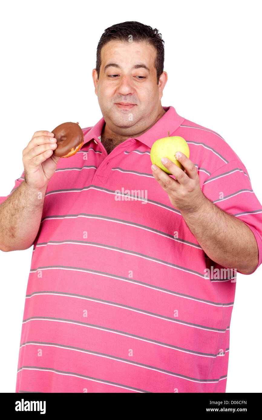 Fat man deciding between a candy and an apple isolated on white ...