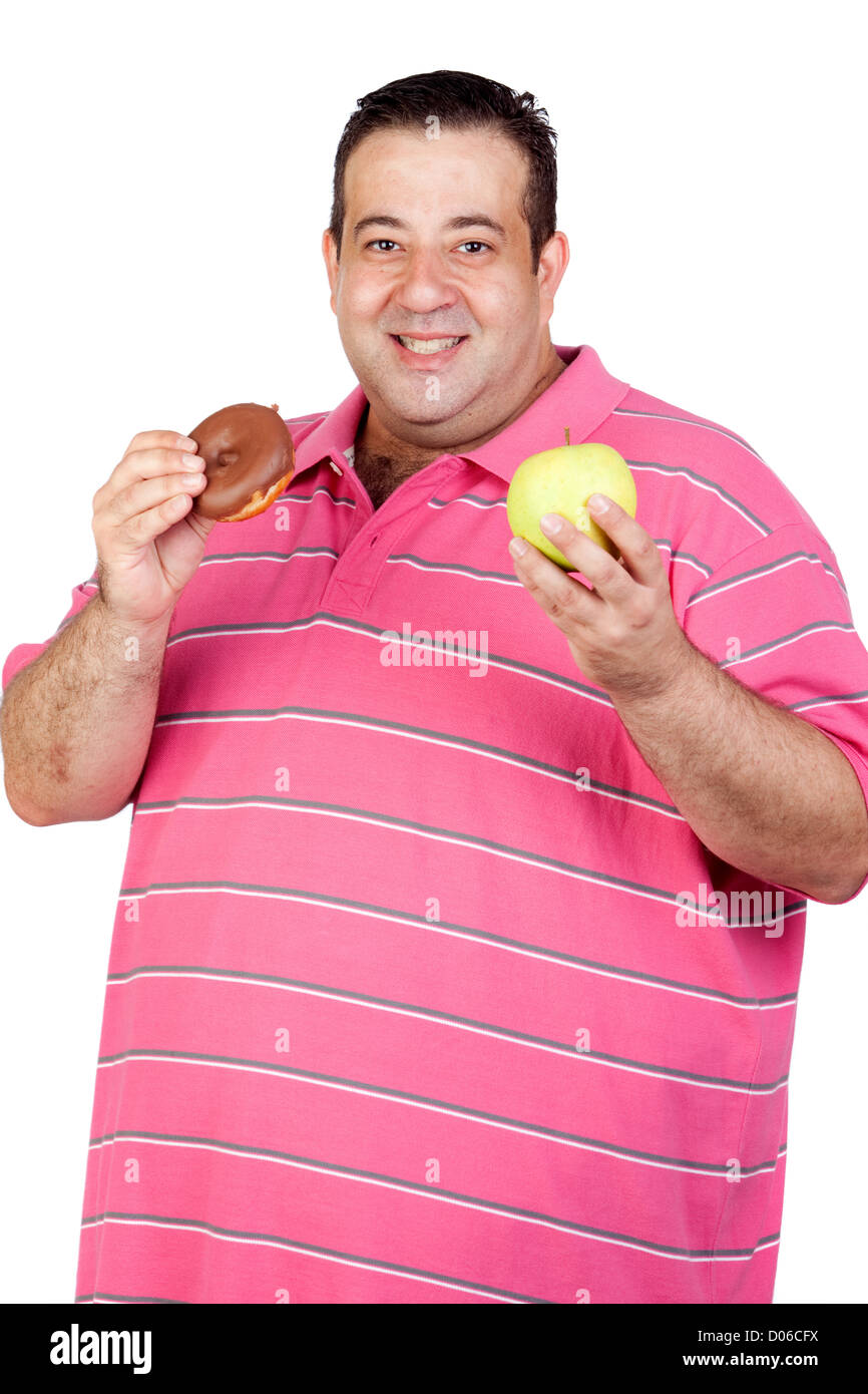 Fat man deciding between a candy and an apple isolated on white ...