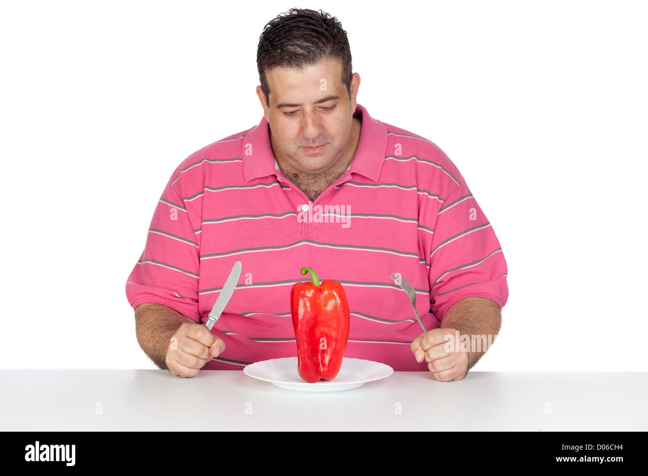 Fat man eating a red pepper isolated on white background Stock Photo ...