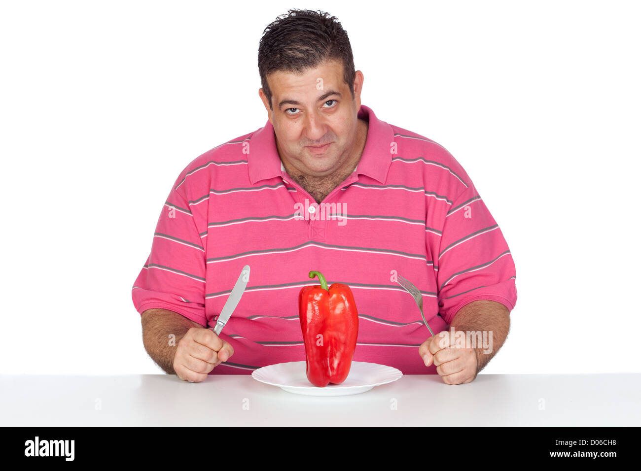 Fat man eating a red pepper isolated on white background Stock Photo ...