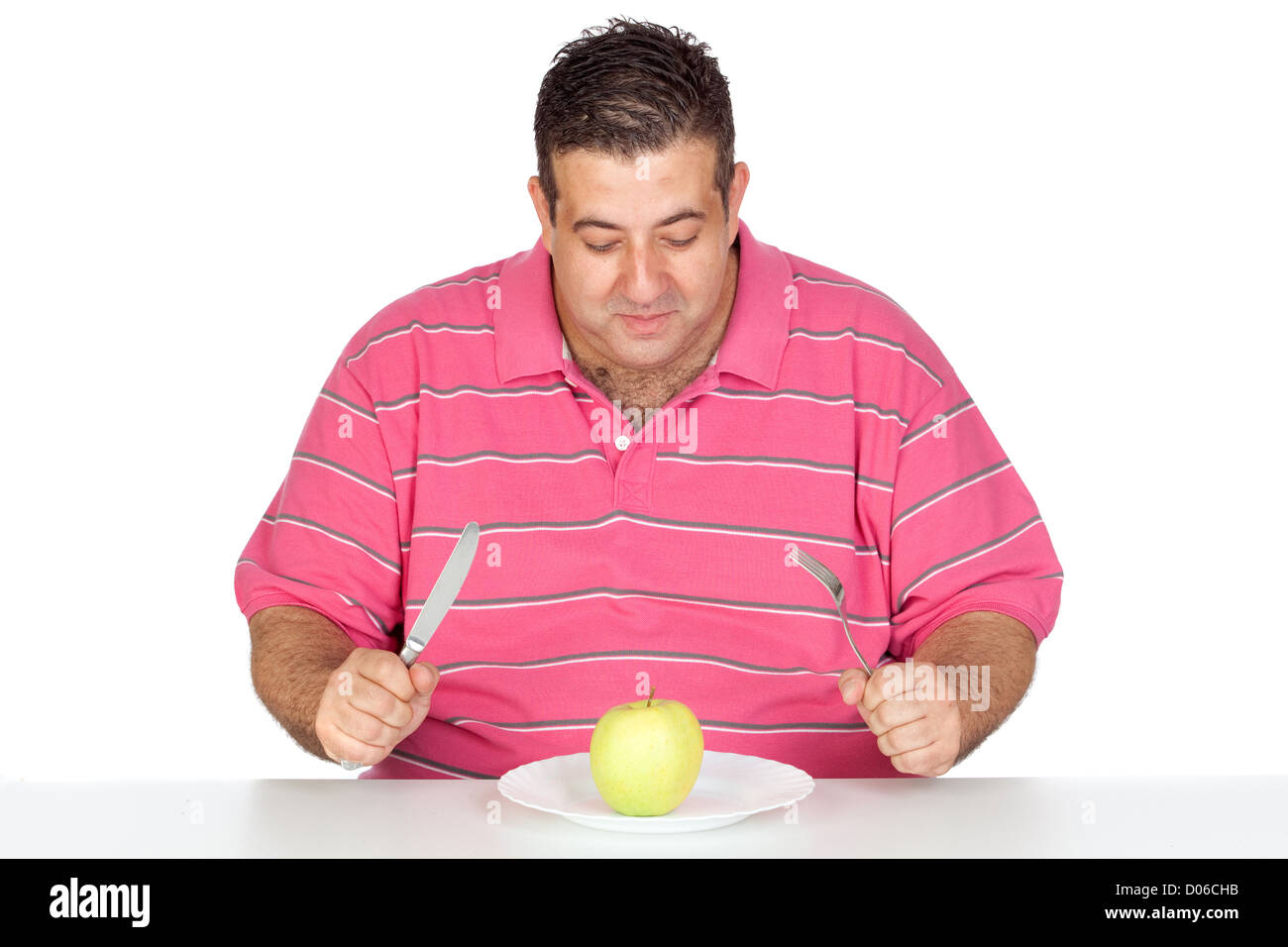 Fat man eating a apple isolated on white background Stock Photo - Alamy