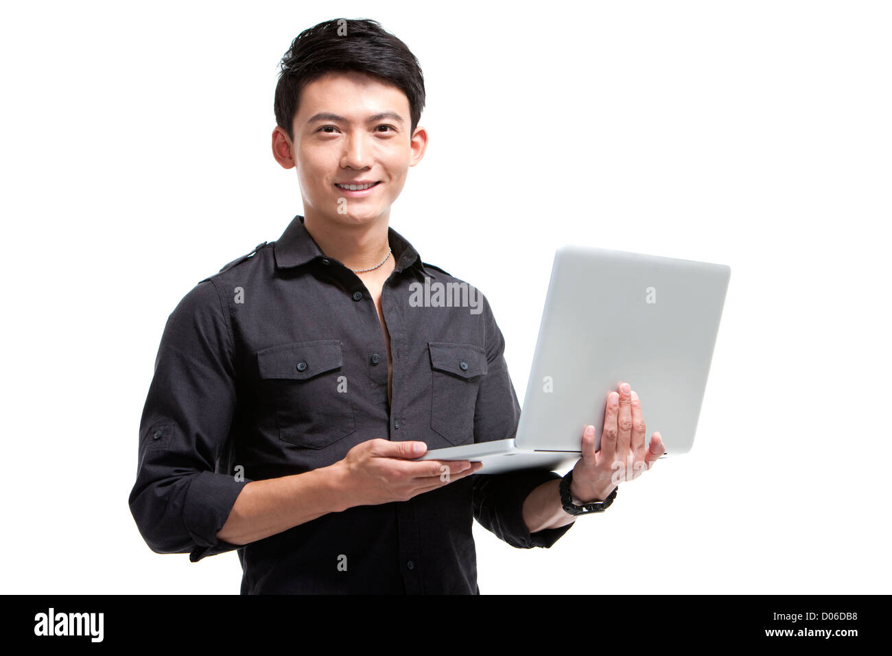 Young man with laptop smiling Stock Photo - Alamy
