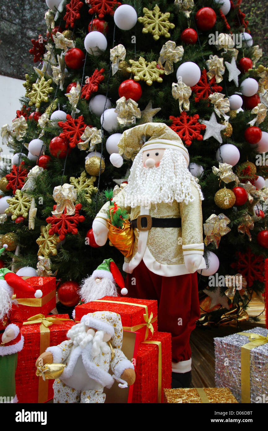 Santa Claus and christmas tree Stock Photo - Alamy