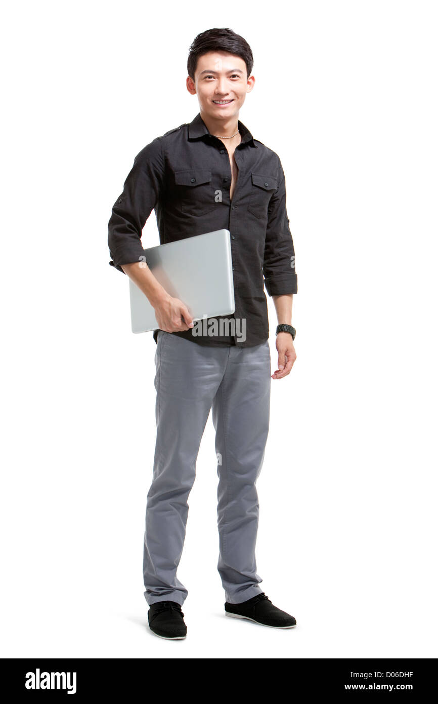 Confident young man with laptop Stock Photo - Alamy