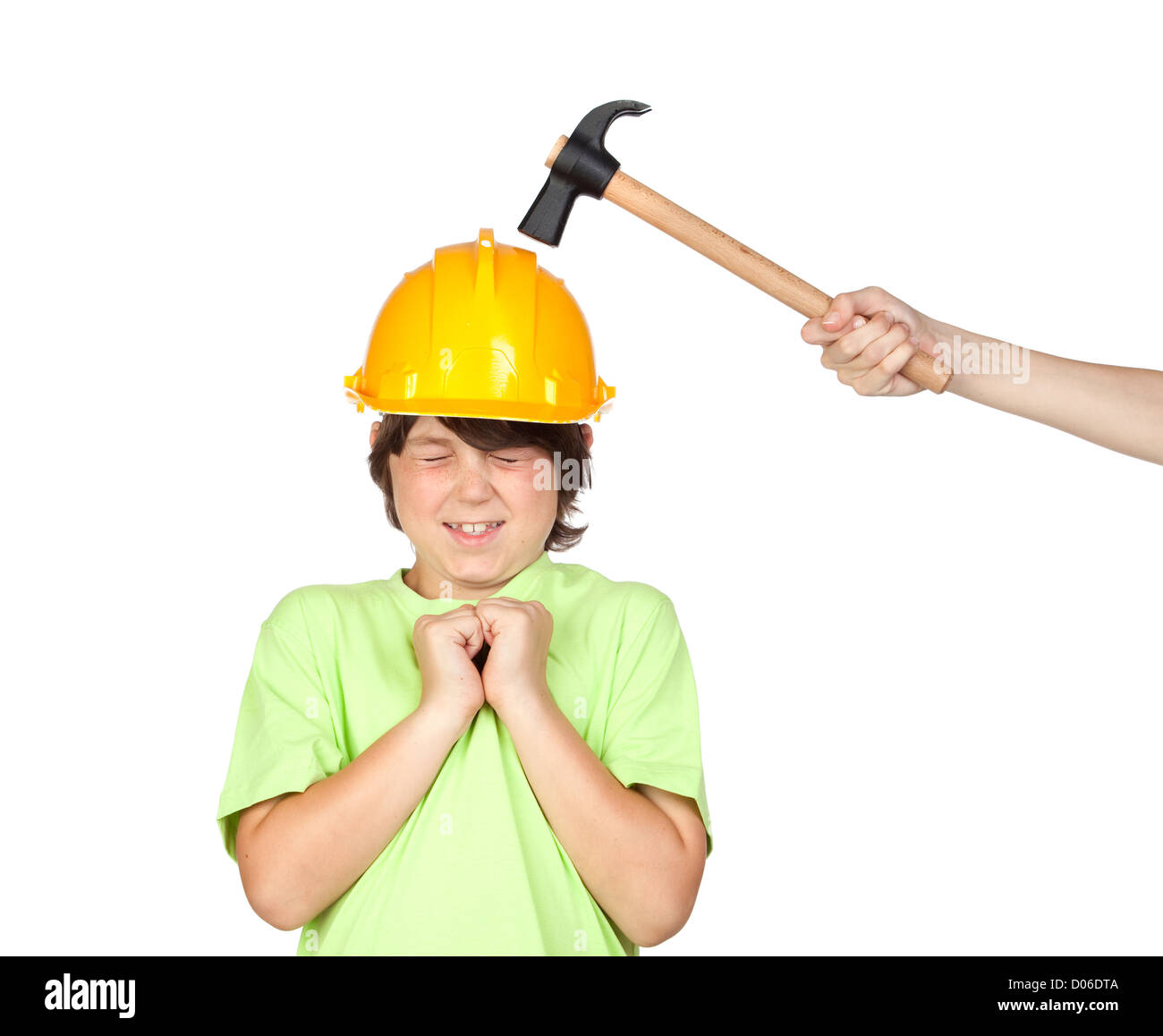 Frightened child with yellow helmet and hammer over a white background ...